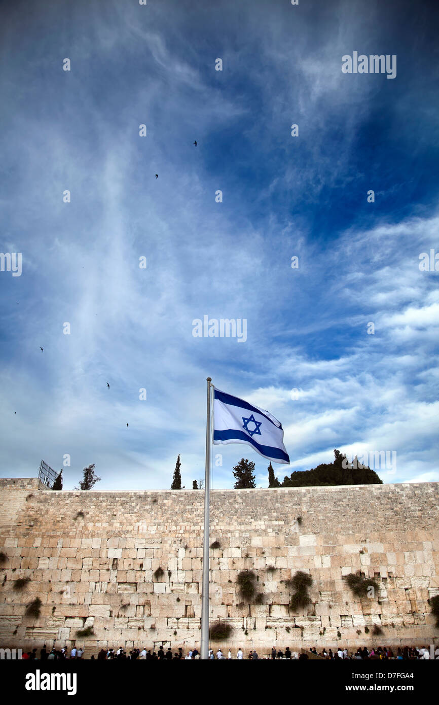 Israel flag fluttering in wind in front holy Wailing Wall one most ...