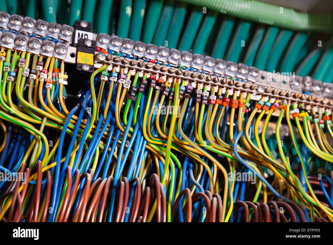 Tilted close-up view very large number electric wires in various colors ...