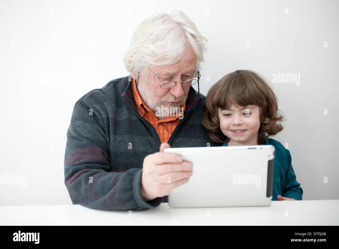 A grandfather explains something to his grandchild Stock Photo - Alamy