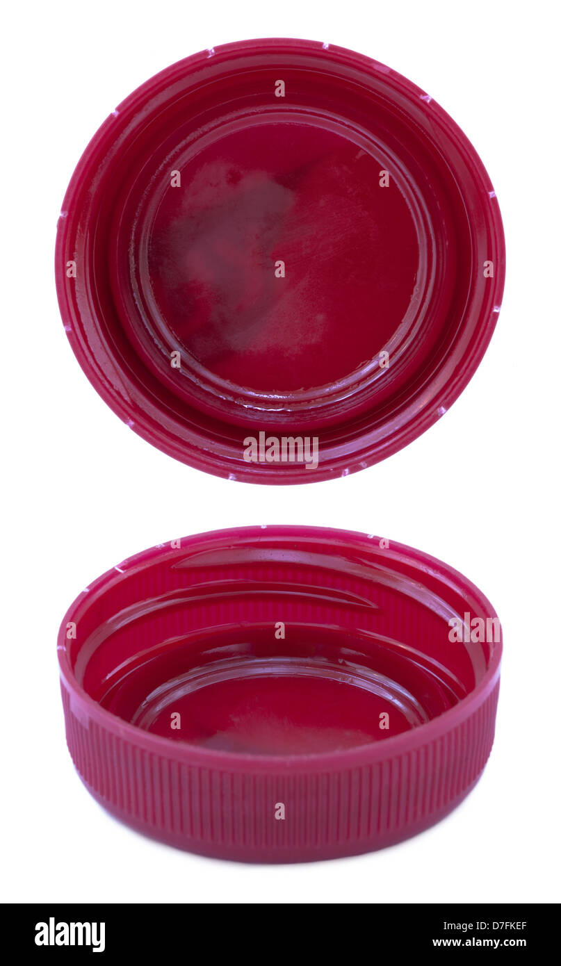 Two angles of the back side of a pink-red plastic bottle cap, isolated ...