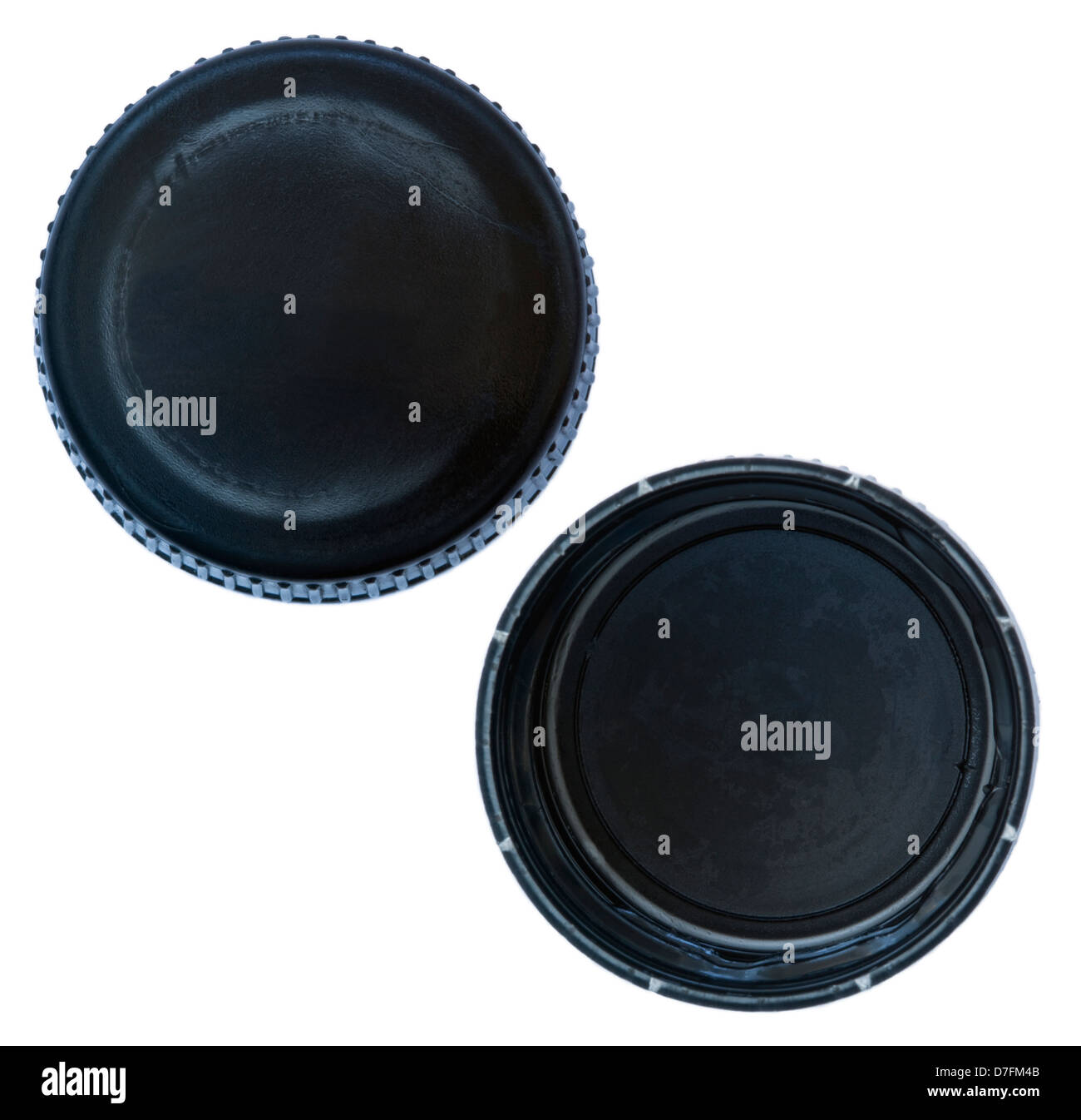 Two sides (top and bottom) of a black plastic bottle cap as seen from ...