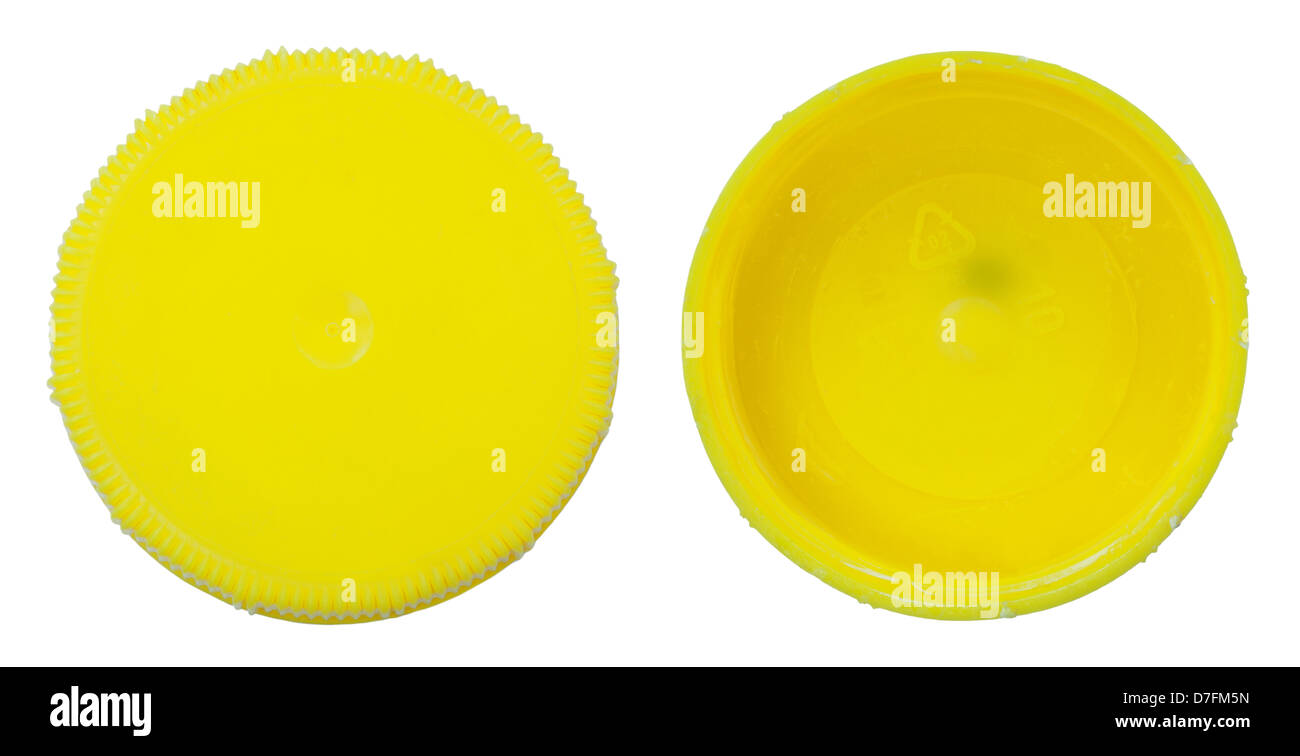 Two sides yellow plastic bottle cap as seen from above one top side two ...