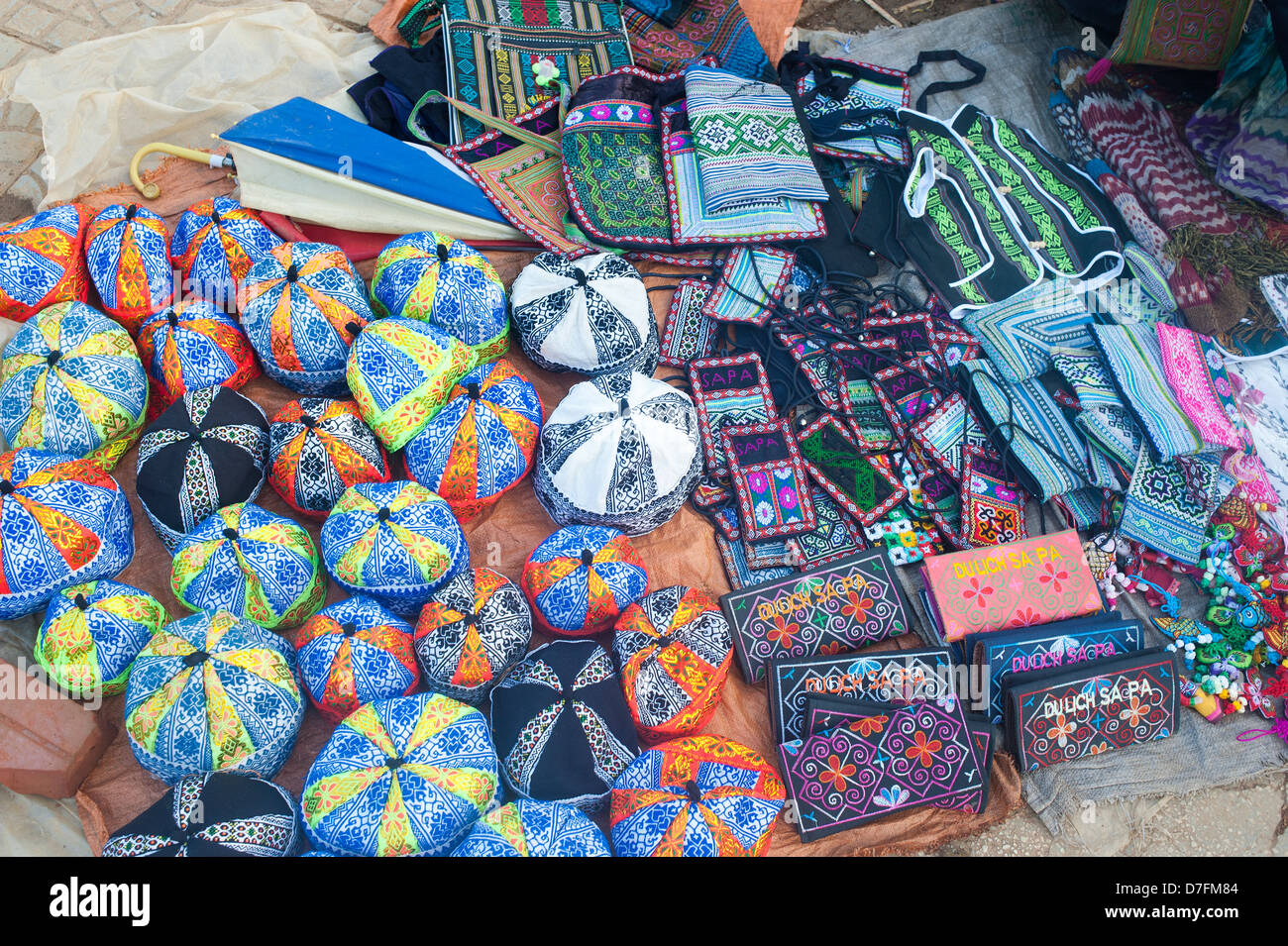 Sapa, Vietnam - Handicraft souvenir patterned fabrics Stock Photo ...