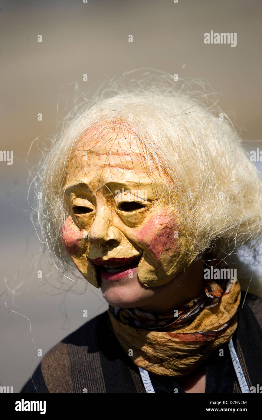 Participants wearing strange weird masks at village carnival in the ...