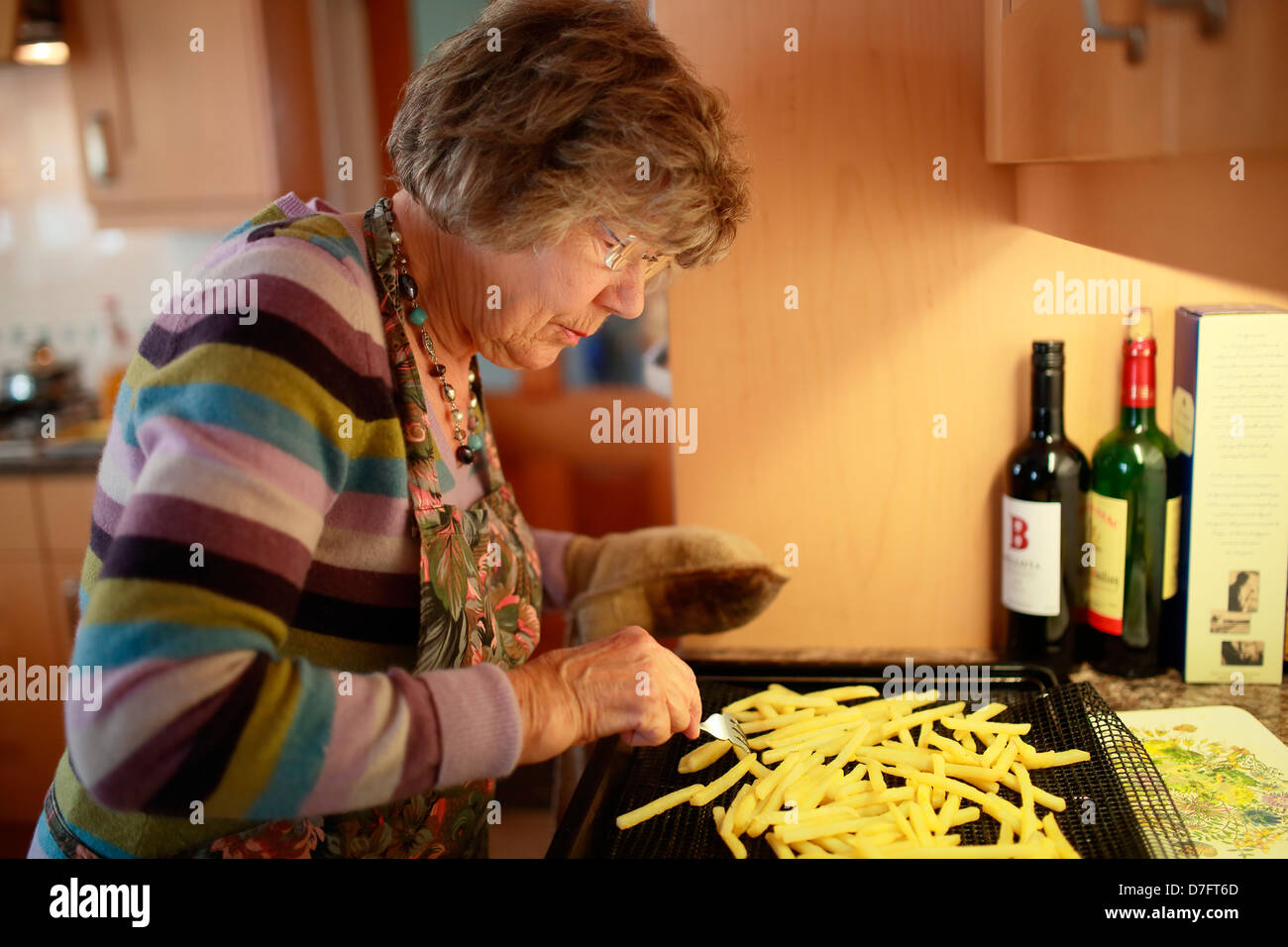 elderly woman cooking Stock Photo - Alamy