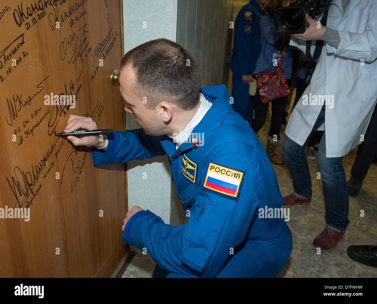 Expedition 35 crew members signed the door at Baikonur Cosmodrome as a ...