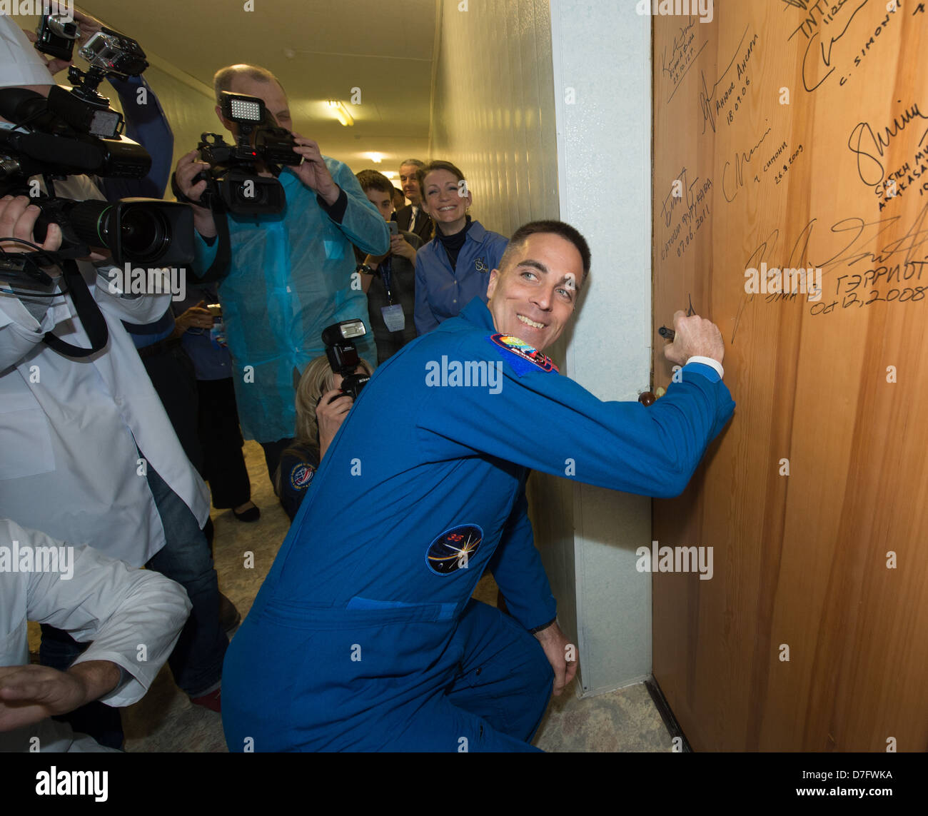Astronauts from Expedition 35 signed a ceremonial door before their ...