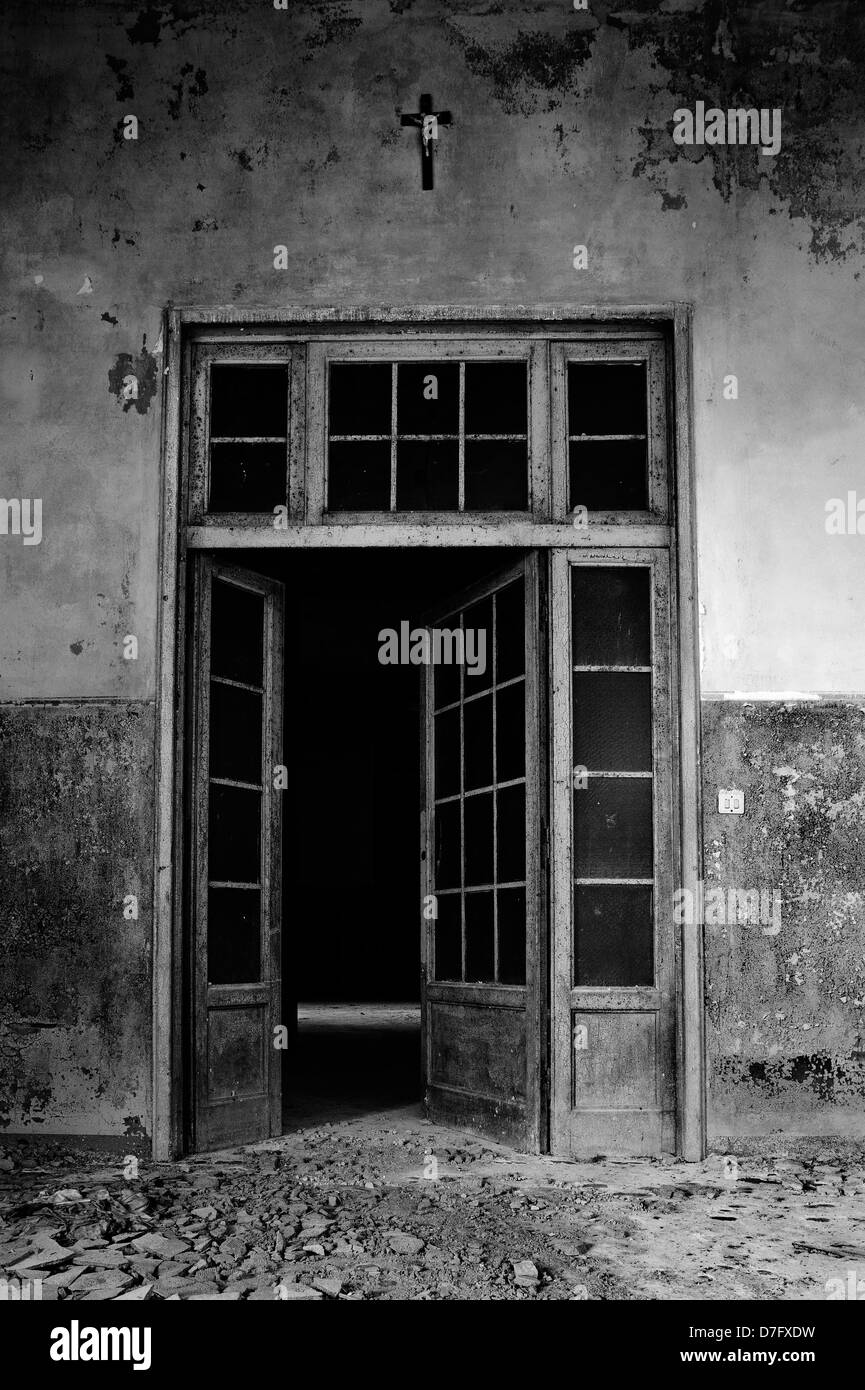 Italy. Abandoned hospital door with cross on the wall Stock Photo - Alamy