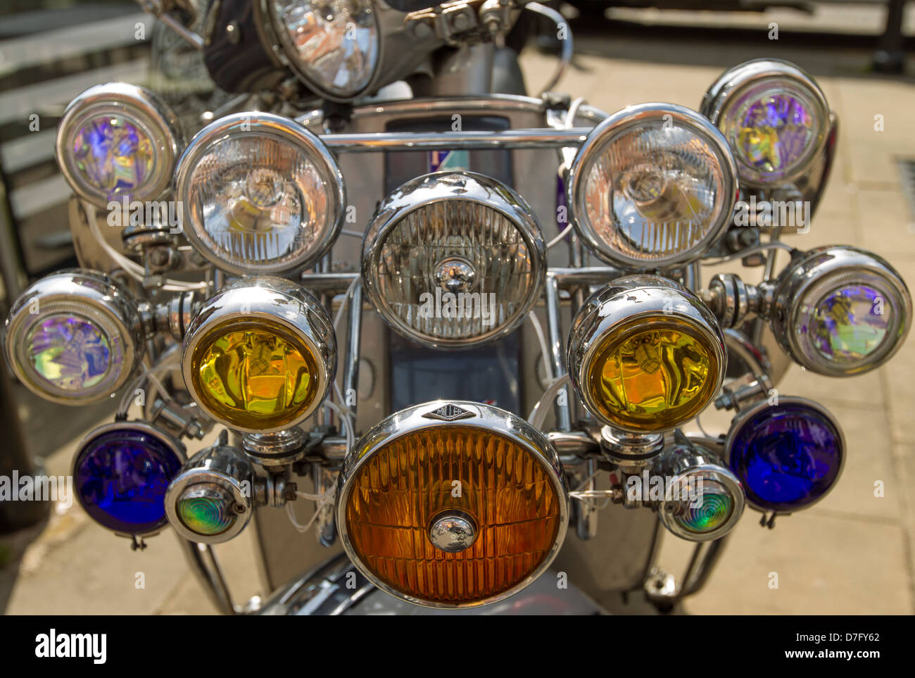 Cluster of spotlights on the front of a motor scooter Stock Photo - Alamy