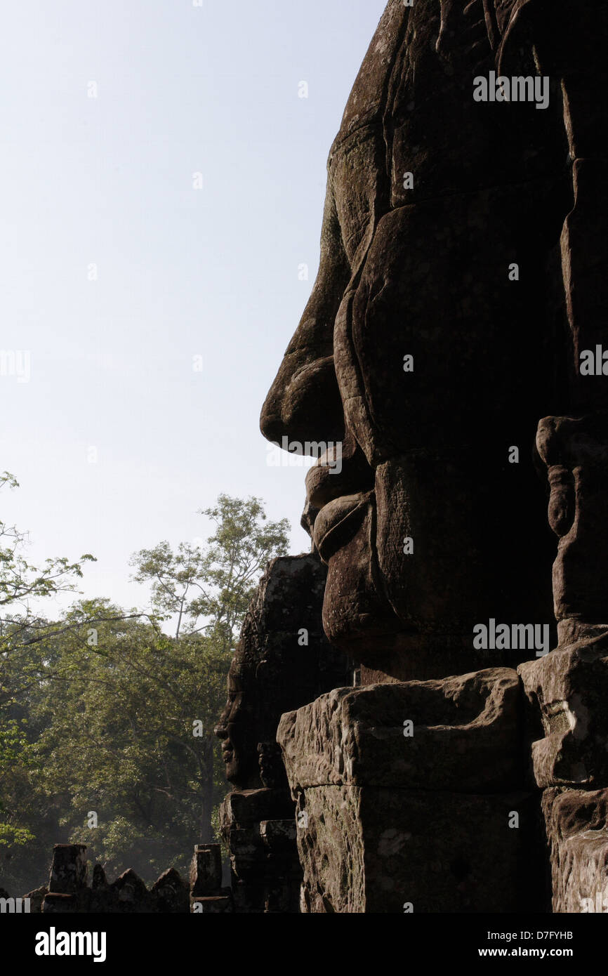 One of the more than 200 carved heads which dominate the Bayon, the ...