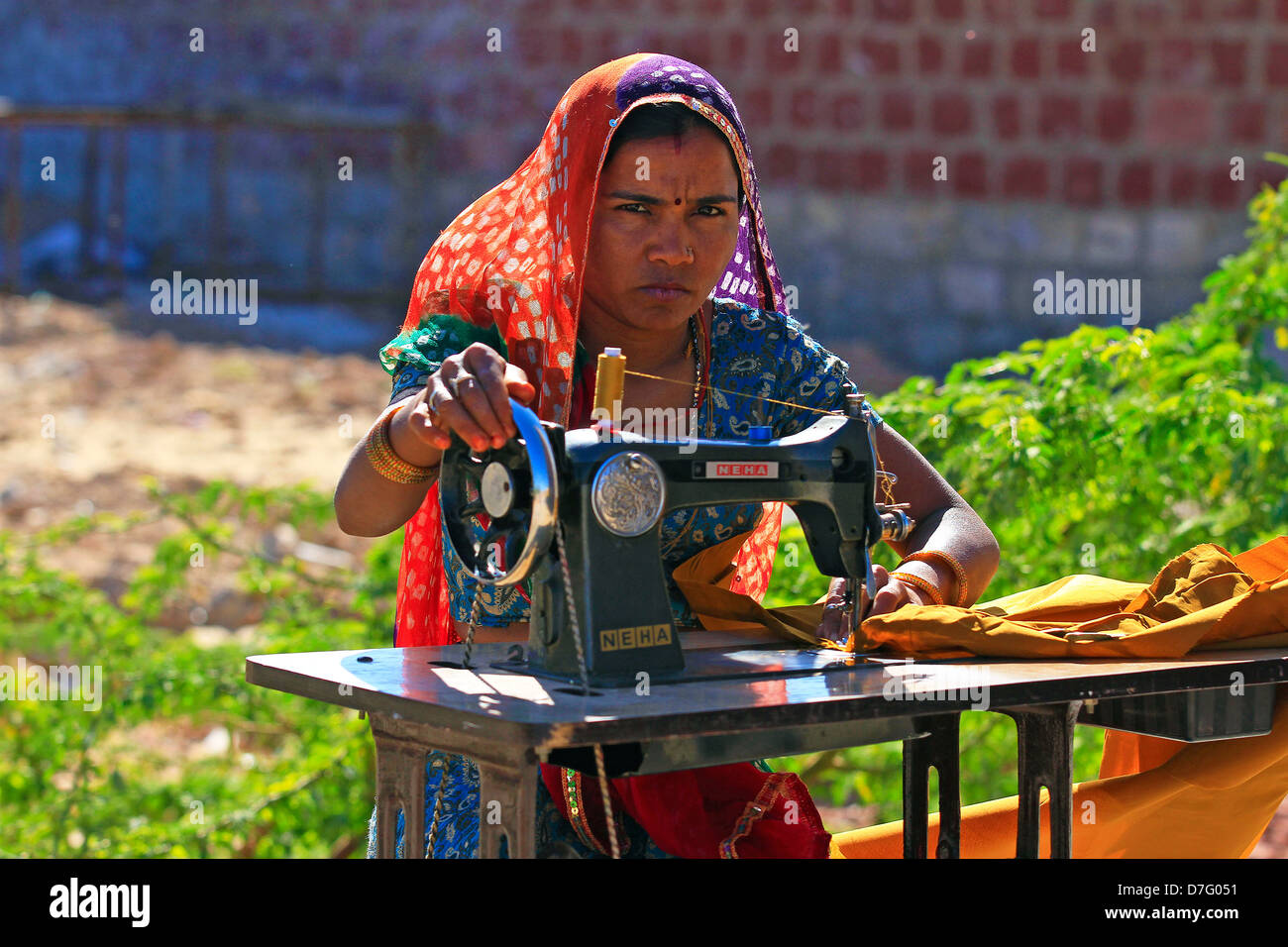 Indian woman sewing hi-res stock photography and images - Alamy