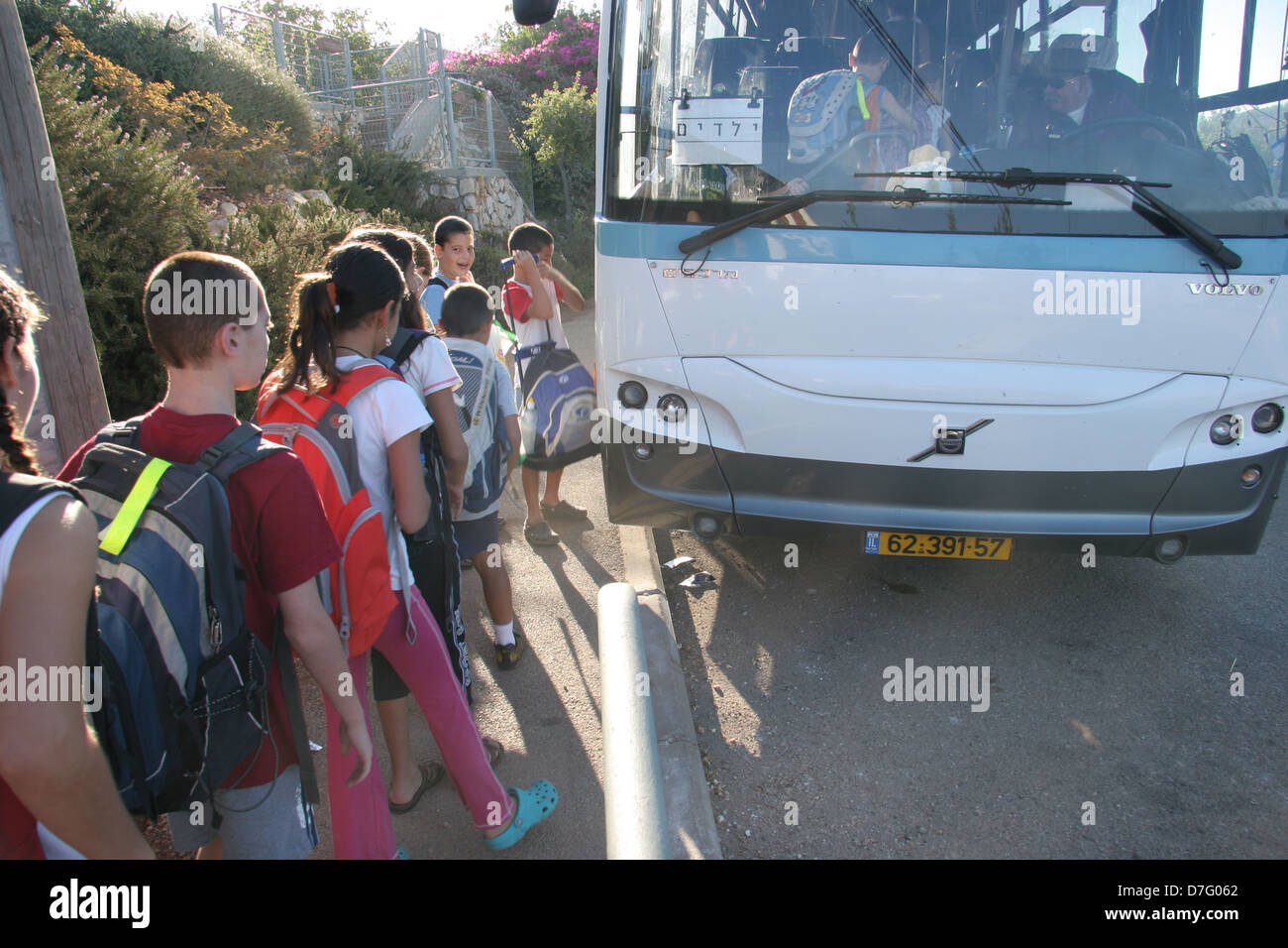 children boarding school bus Stock Photo - Alamy
