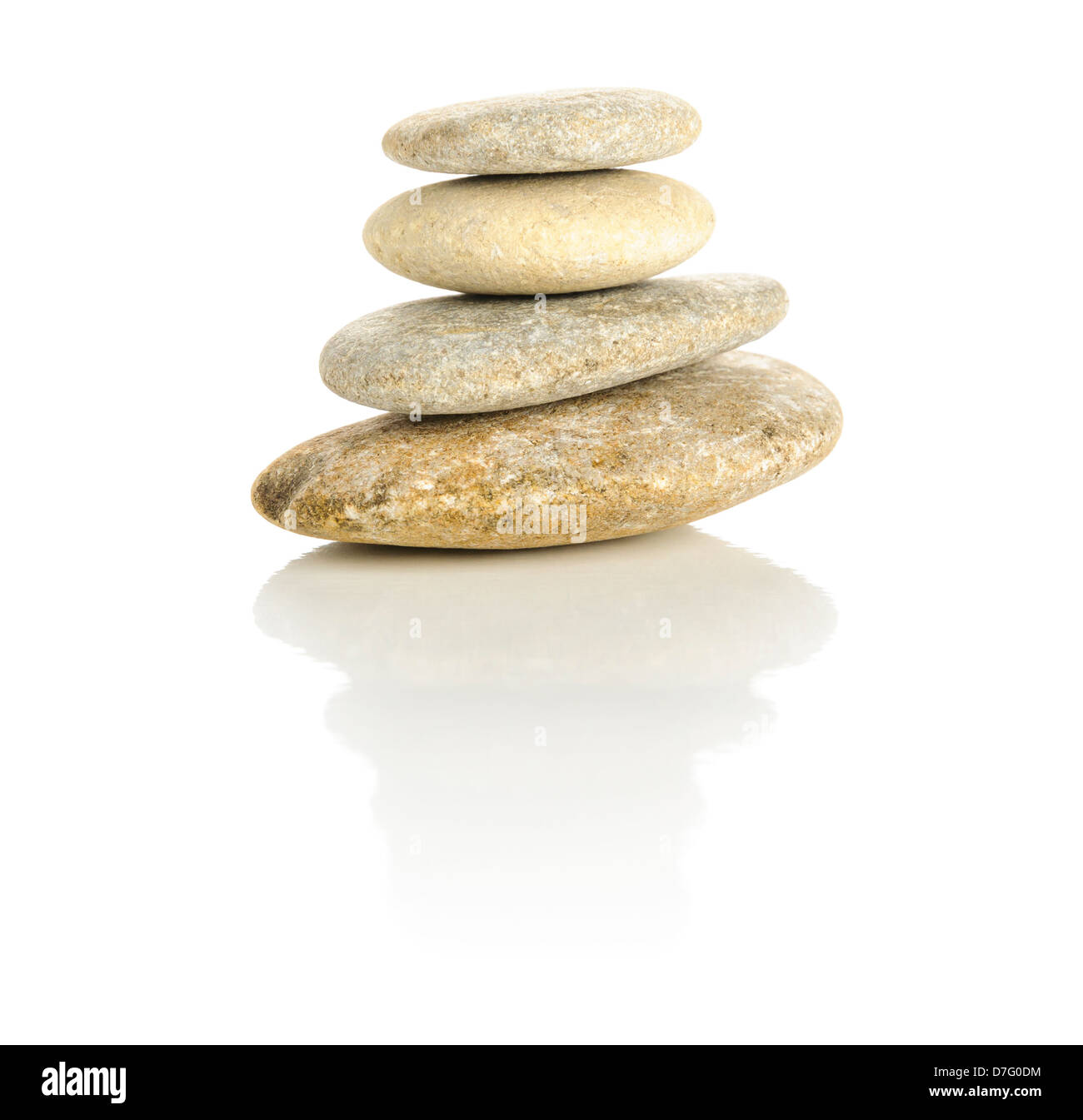 Pile of four pebble stones stacked in a pyramid isolated on a white ...