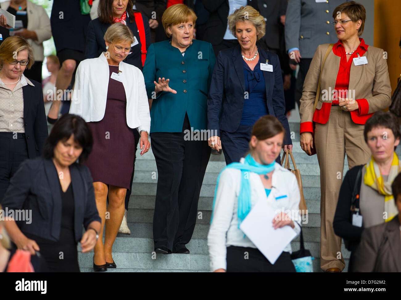 German chancellor Angela Merkel (C) poses for a group photo during a ...