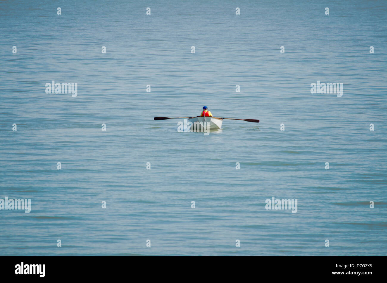 Rowing boat out at sea Stock Photo - Alamy