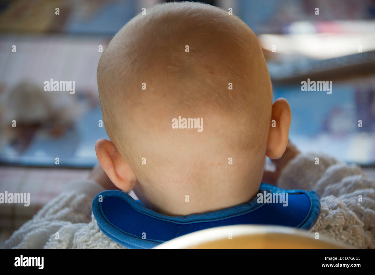 A baby boy photographed from behind showing the shape of his head Stock ...