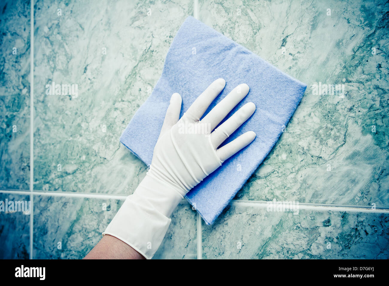 female hand cleaning kitchen tiles with sponge Stock Photo - Alamy