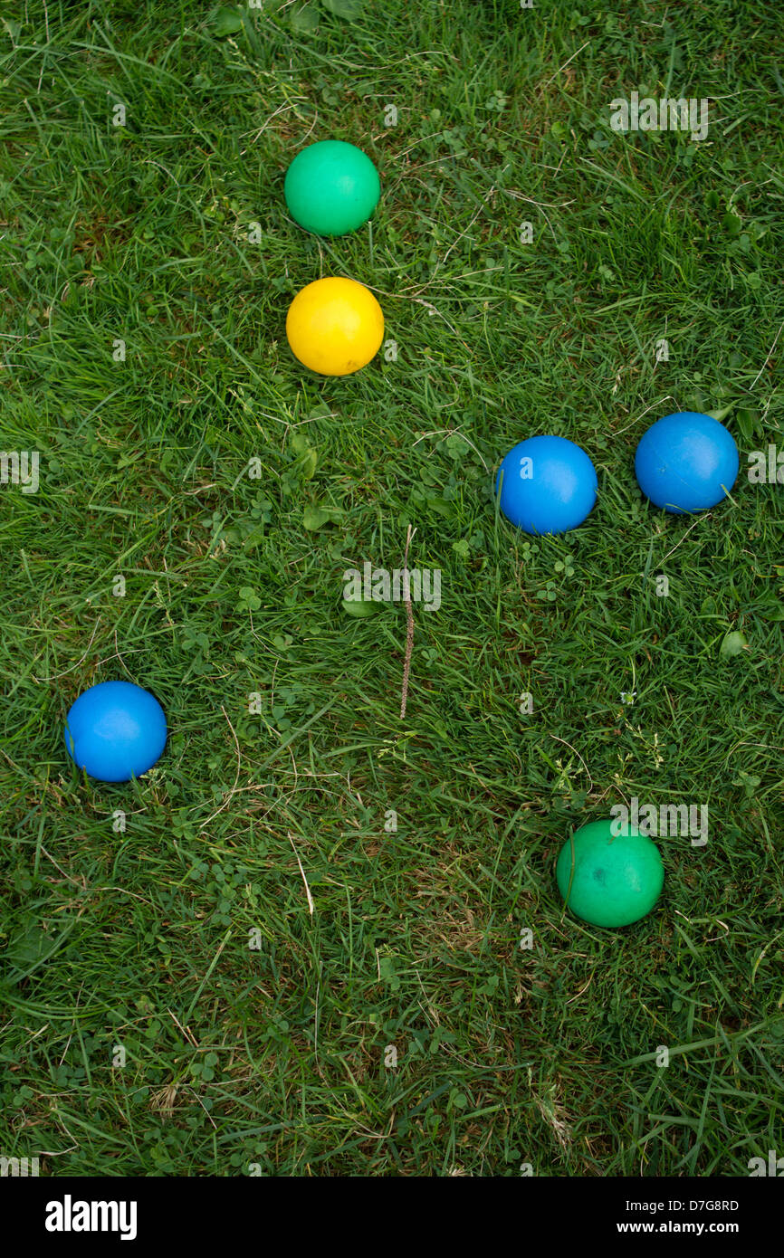Colourful balls laying on the grass Stock Photo - Alamy