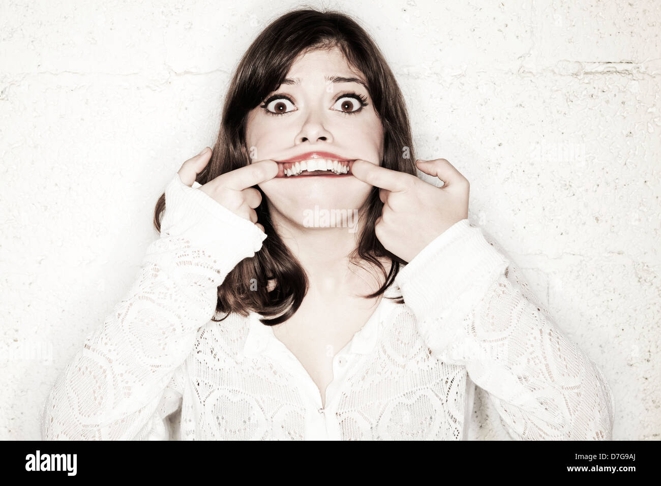 Portrait beautiful young woman her big eyes wide open looking in sheer ...