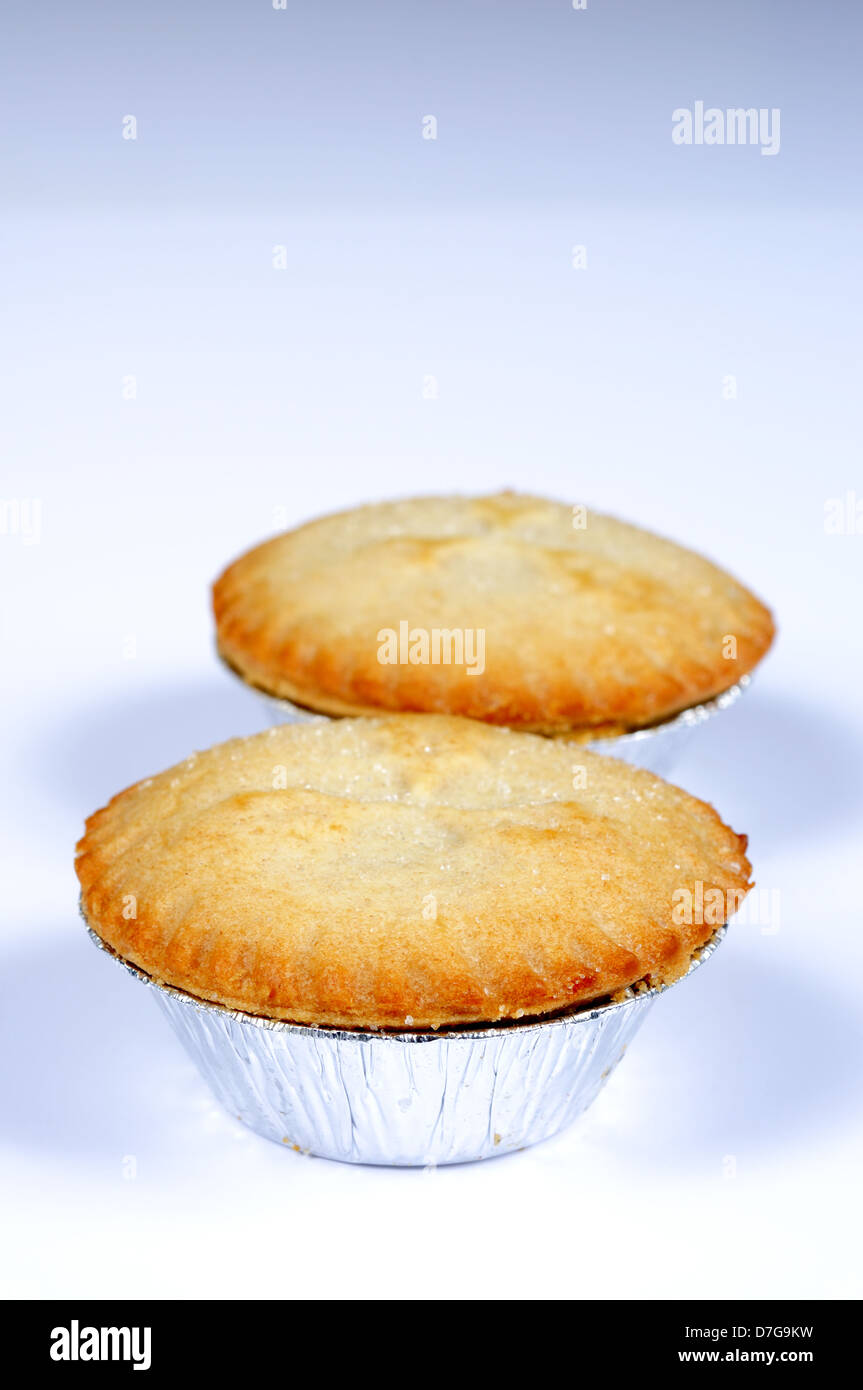 Two mince pies against a grey and white background Stock Photo - Alamy