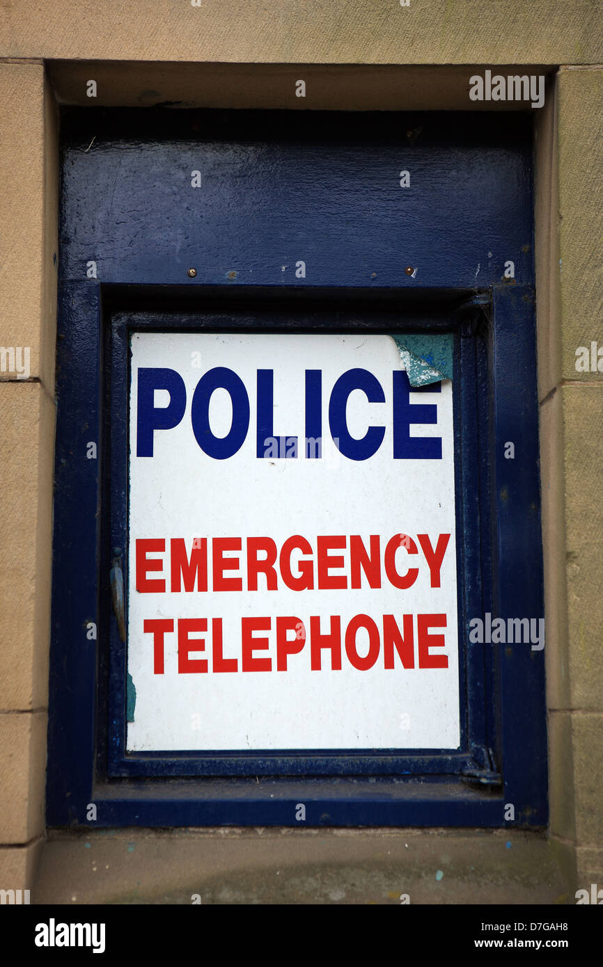 Old fashioned Police Emergency Telephone inset into a building in the ...
