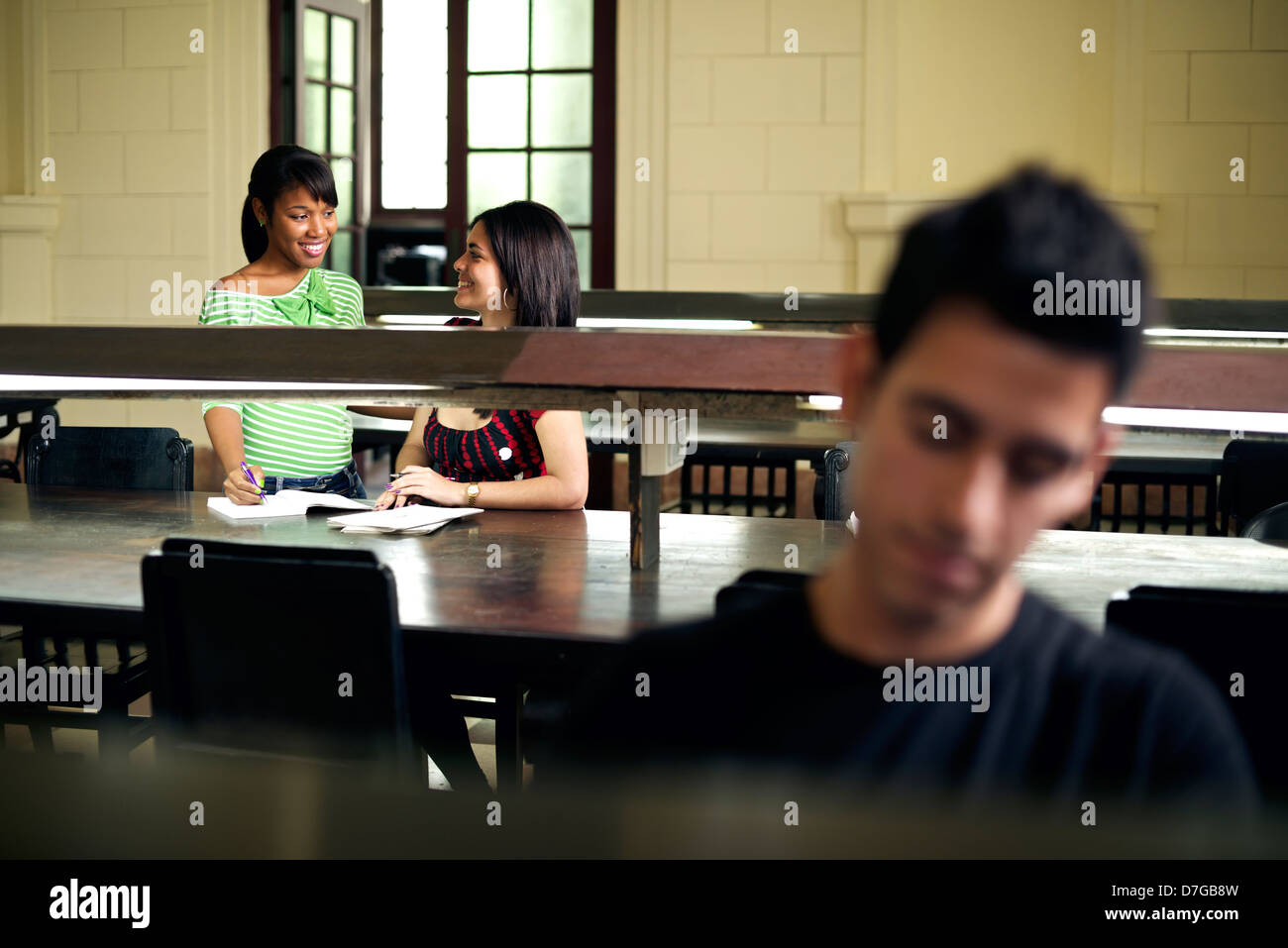 Young people at school, male and female students studying and doing ...
