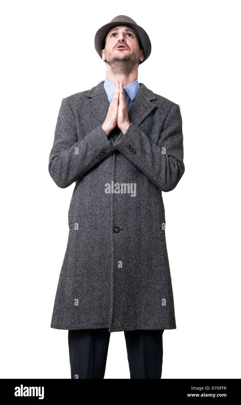 Man pleading hands together looking Cut Out Stock Images & Pictures - Alamy