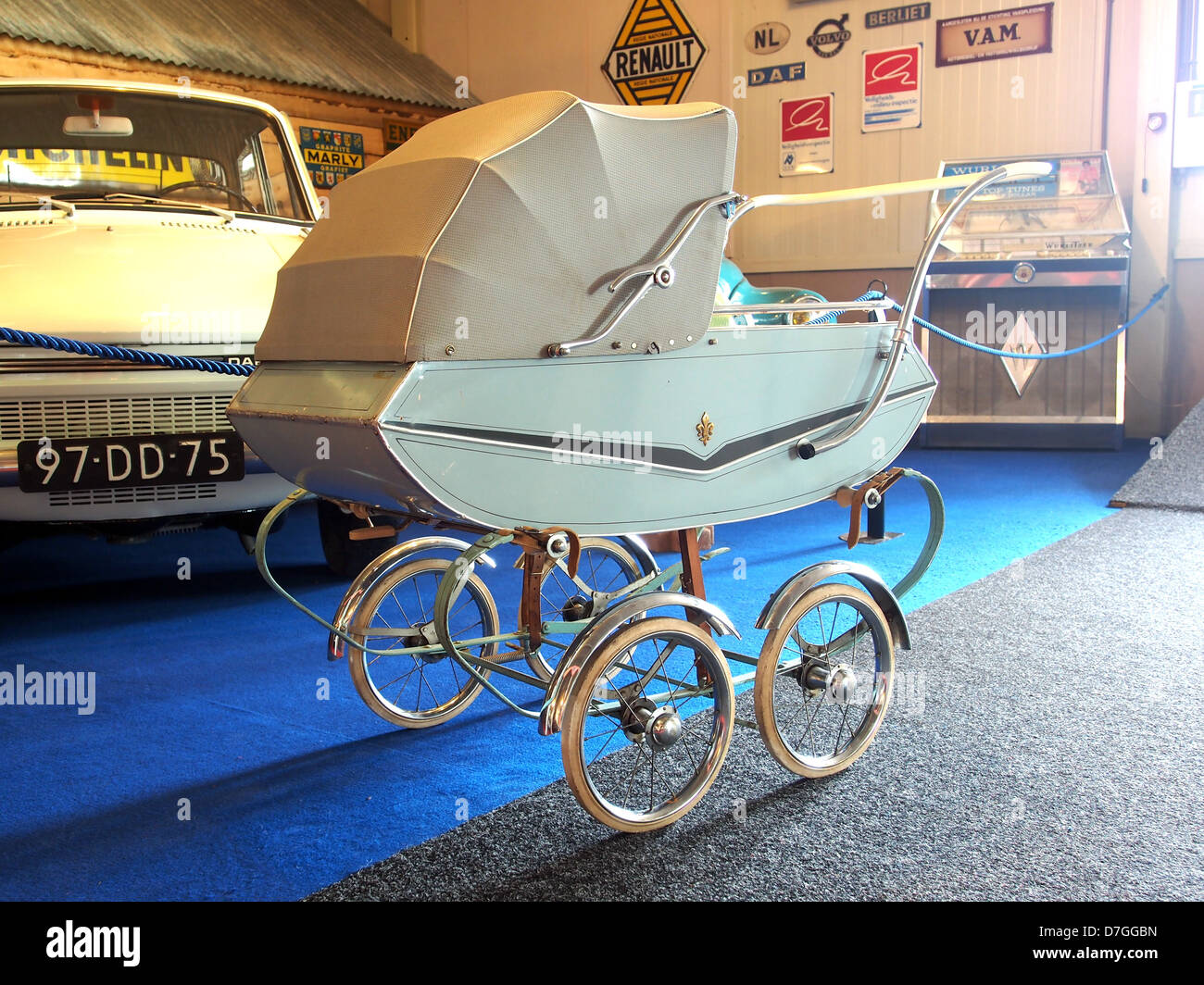 A historical photograph of a vintage stroller or pram from the early ...