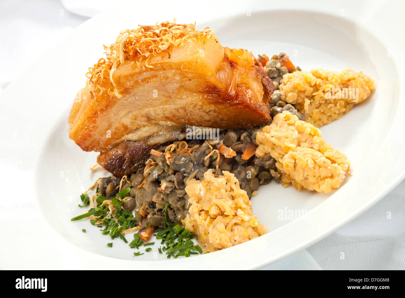 Baked Bacon with green and yellow lentil Stock Photo - Alamy
