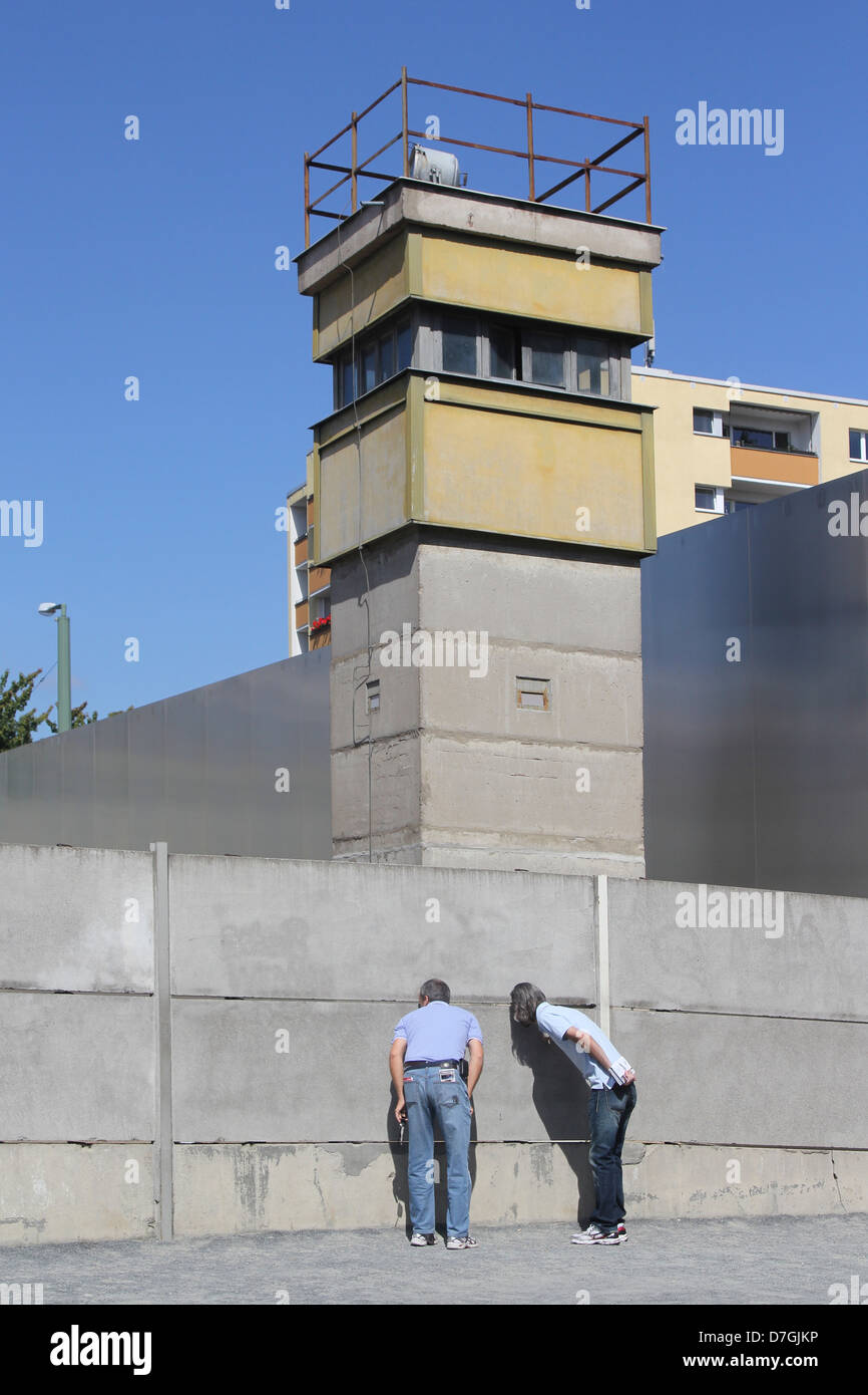 Berlin Wall Memorial people look trough the wall Mitte Bernauer Str ...