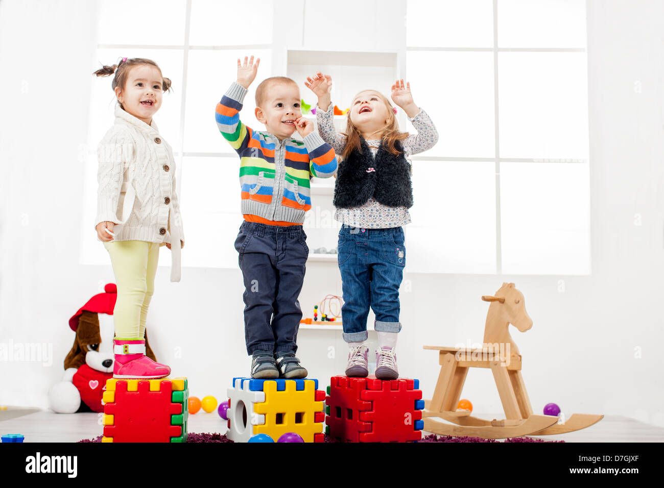 Cute kids playing in the room Stock Photo - Alamy