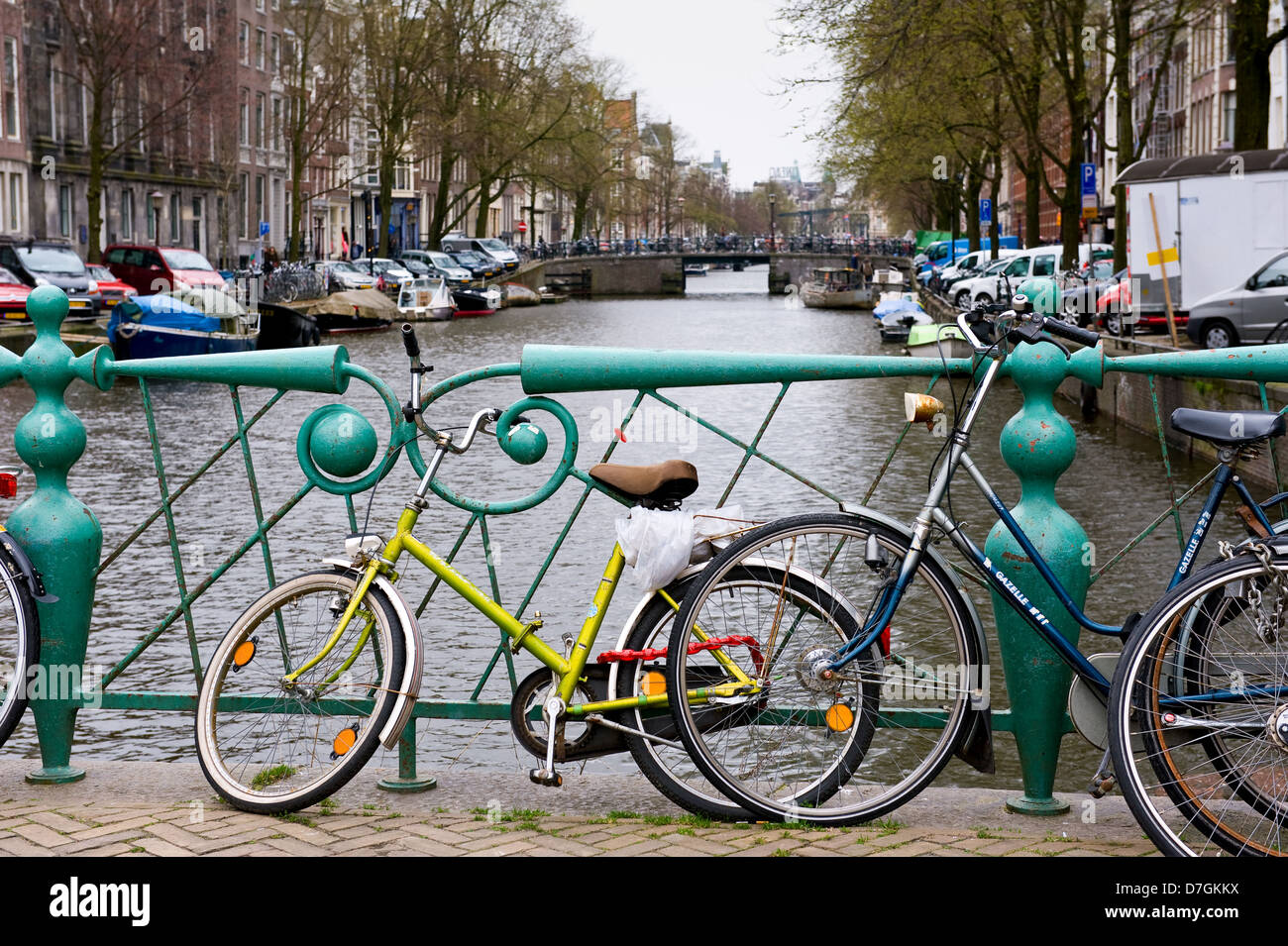Bicycles chained to railing hi-res stock photography and images - Alamy