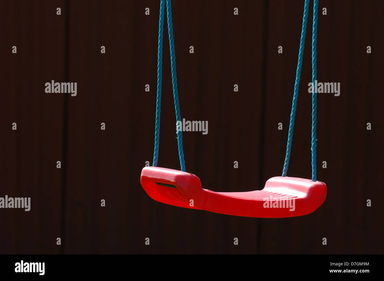 Red swing hi-res stock photography and images - Alamy