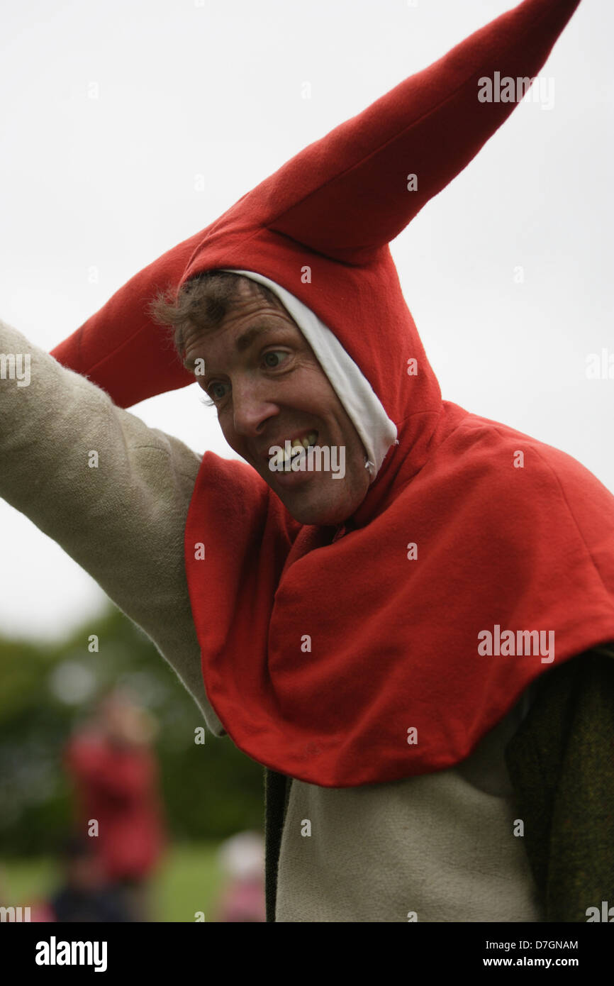 Jester at a medieval pageant wearing medieval costume Stock Photo - Alamy
