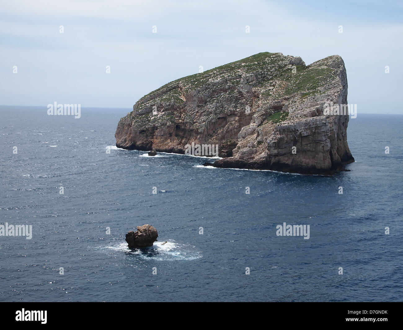 A mighty rock in the Mediterranean sea Stock Photo - Alamy