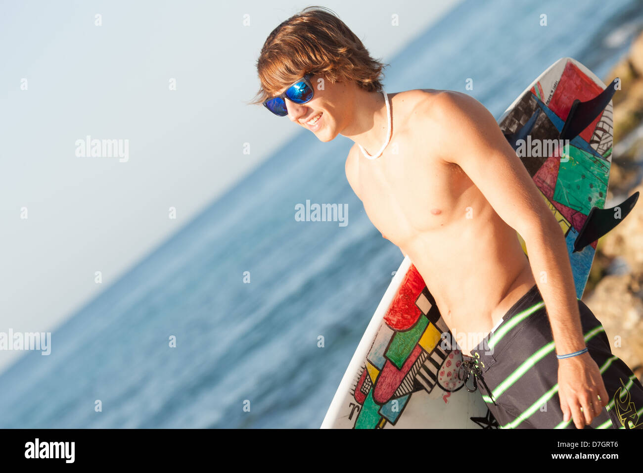 young surfer about to get into the sea Stock Photo - Alamy