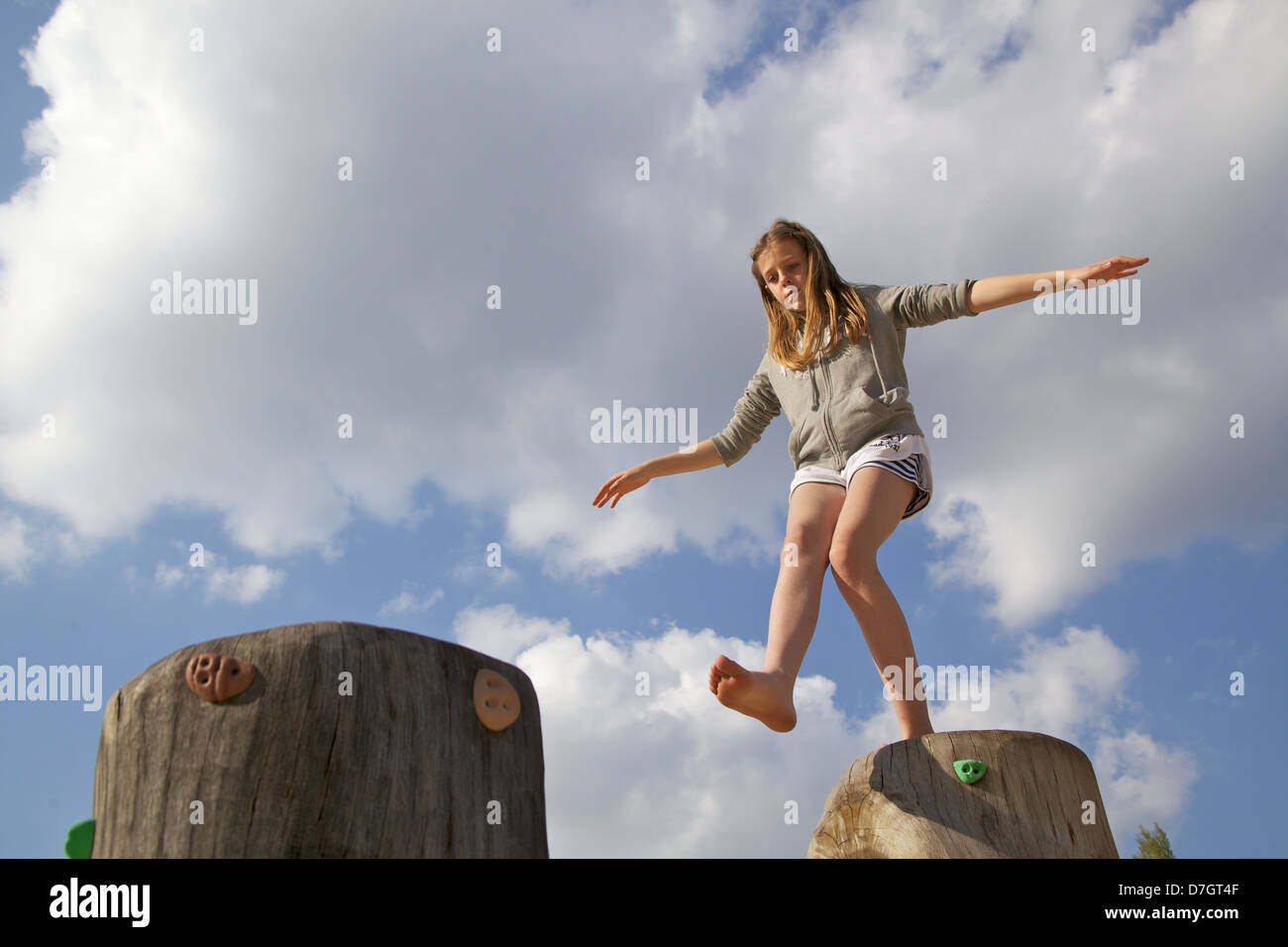 Girl at the foot of a tree hi-res stock photography and images - Alamy