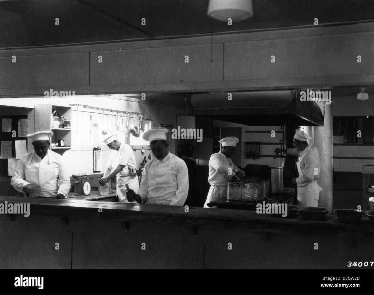 This photograph captures the kitchen crew at the Lower Cispus Civilian ...