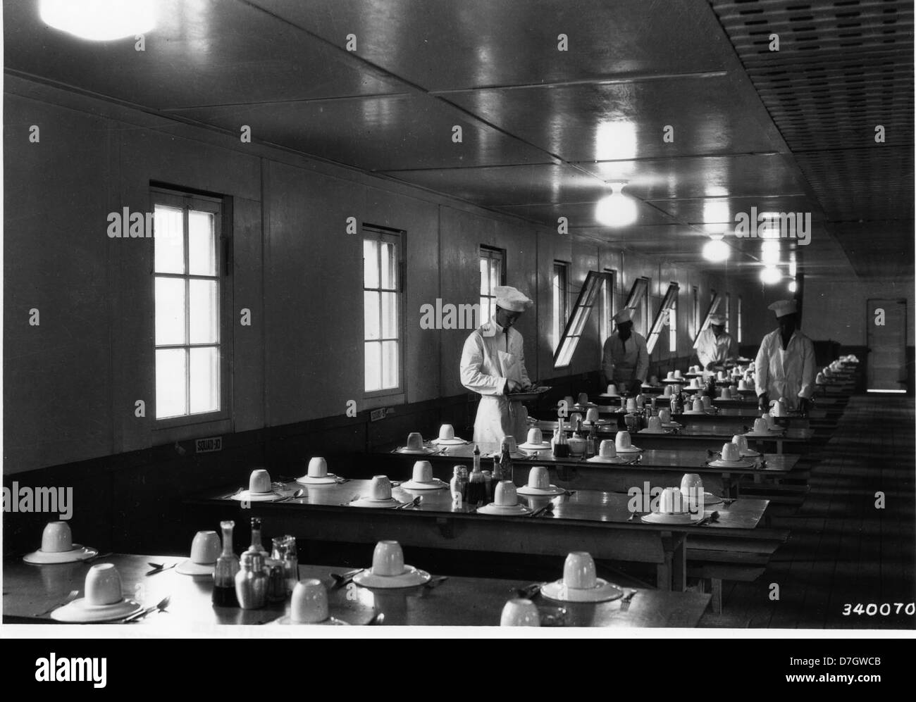 This photograph captures a moment in the mess hall at the Lower Cispus ...