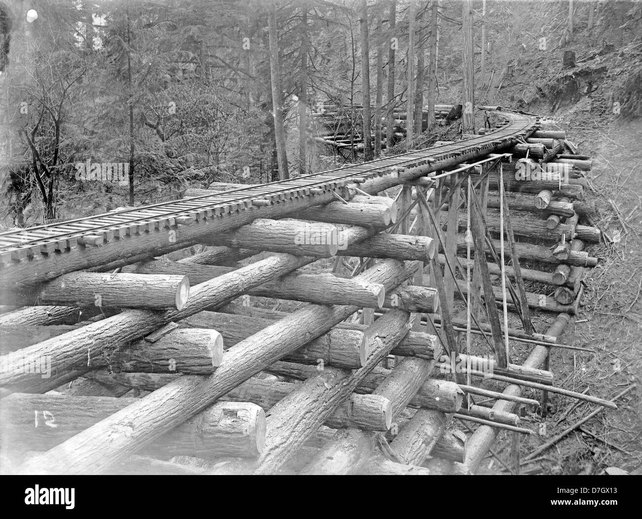This photograph shows a log bridge (crib trestle) on the Columbia and ...