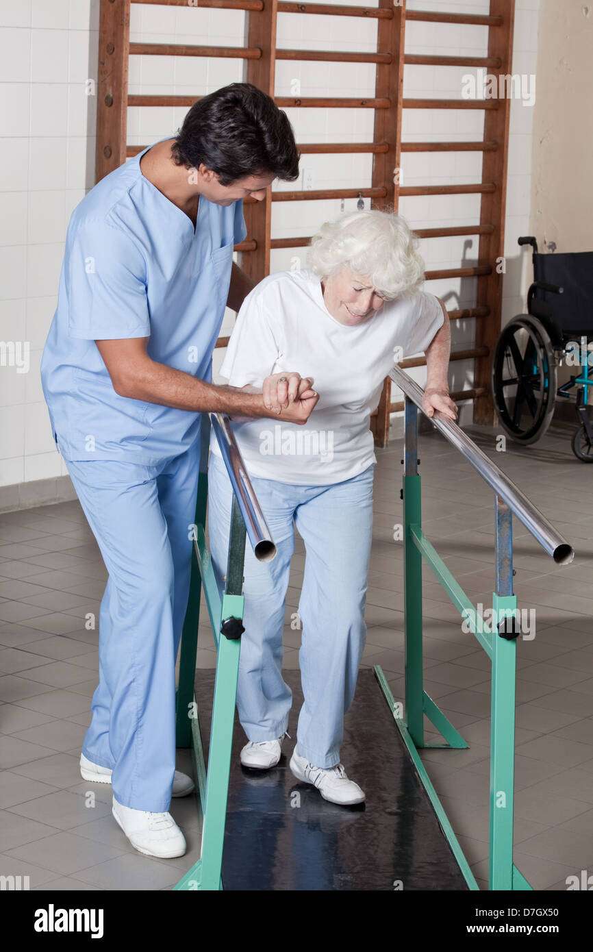 Doctor helping Patient Stock Photo - Alamy
