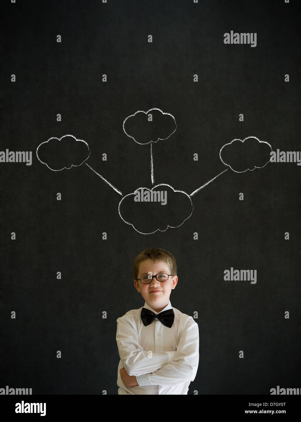 Thinking boy dressed up as business man with strategy thought chalk ...
