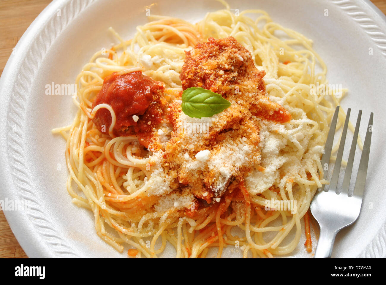 Grated Parmesan Cheese Over Pasta and Sauce with a Basil Leaf Stock ...