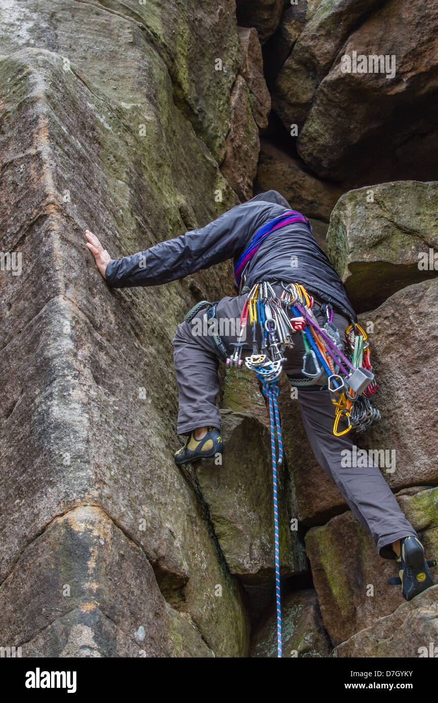 Male climber bridging on Flying Buttress Gully - Diff at Stanage Edge ...