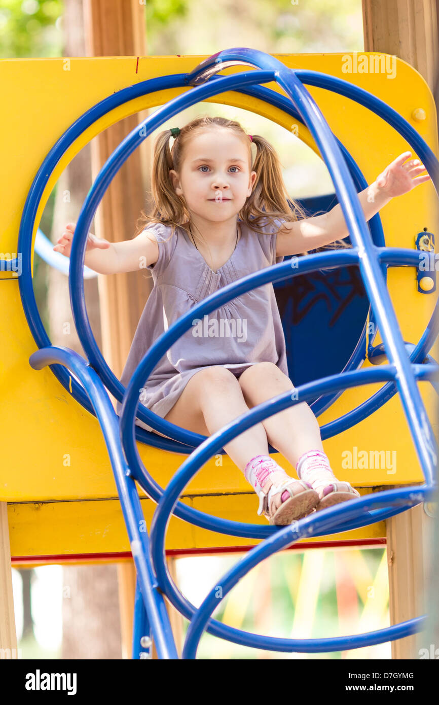 Beautiful little girl on outdoor playground at summertime Stock Photo - Alamy