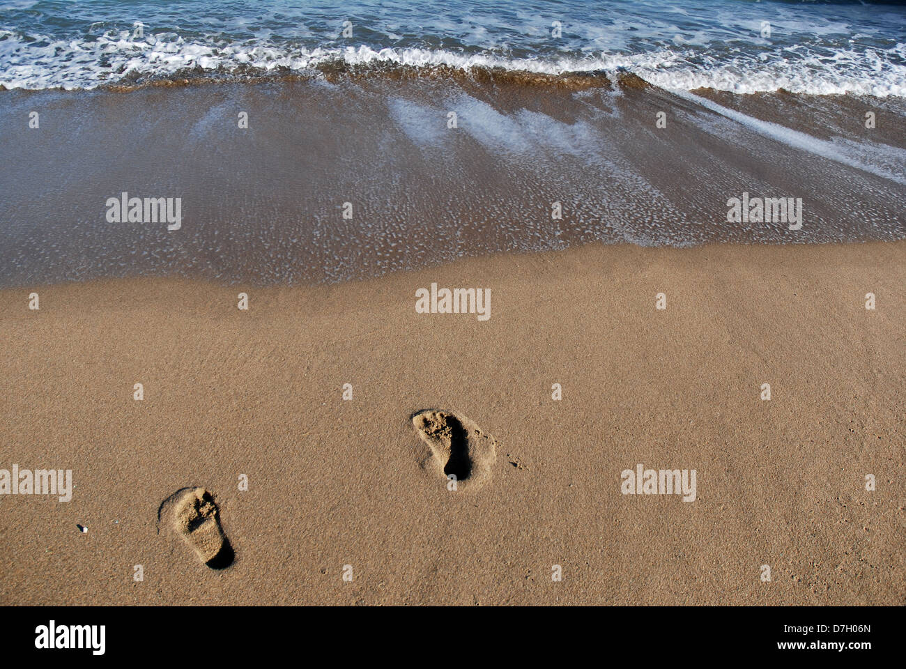 footprints in the sand on the beach Stock Photo - Alamy