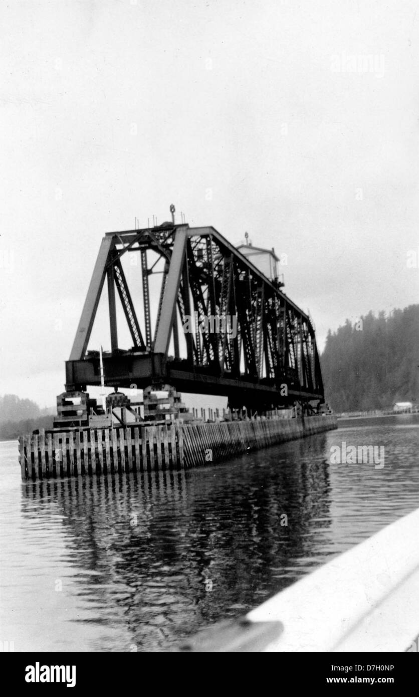 This historic photograph showcases the railroad bridge over the Umpqua ...