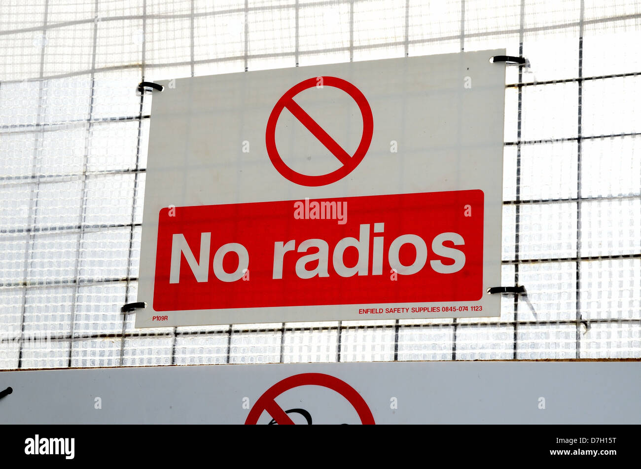 'No Radios' sign on building site fence Stock Photo - Alamy