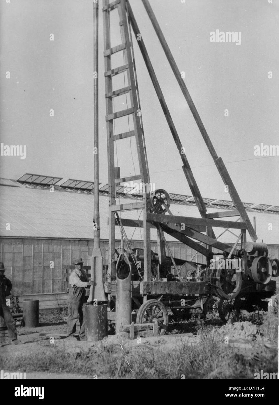 This historical image from circa 1920 shows the drilling of an ...