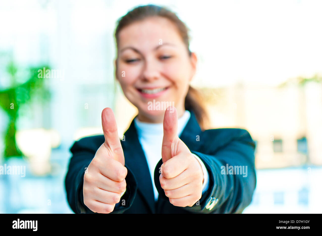 Young business woman shows that everything is fine Stock Photo - Alamy